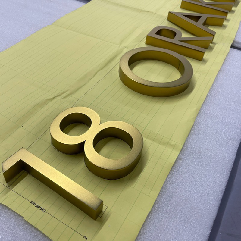 The Allure of Metal Titanium Gold Backlit Letters in Modern Signage ...